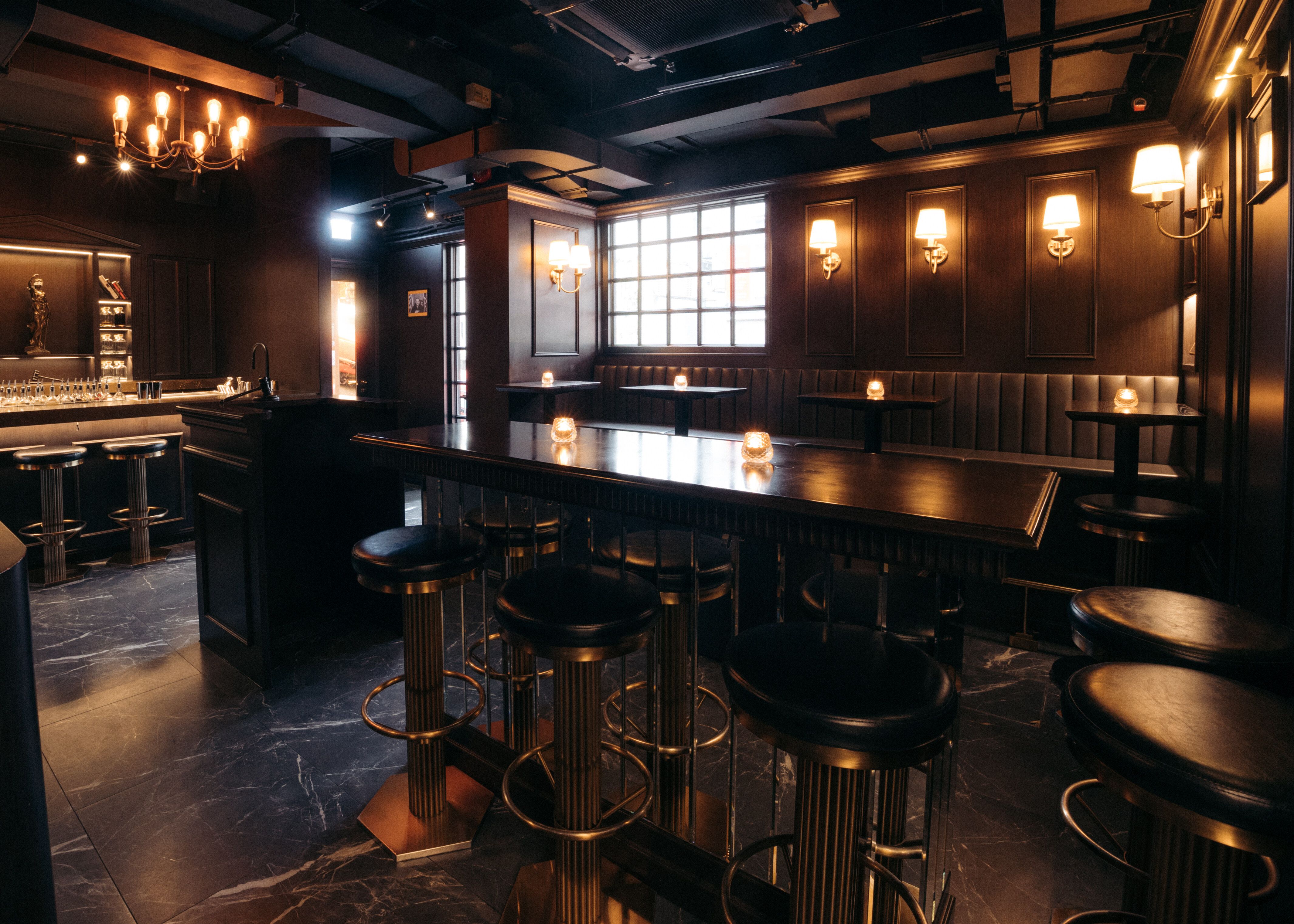Low Lighting Courtroom-Inspired Cocktail Bar With Gold Accents for ...